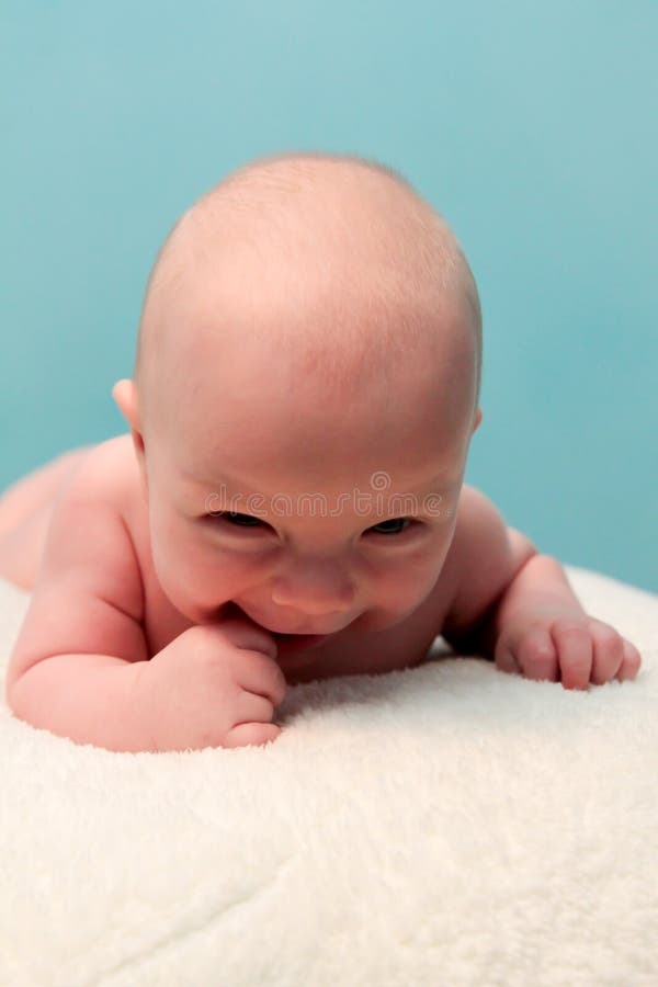 Baby Smiles into the Camera Lens Stock Photo - Image of bedroom ...