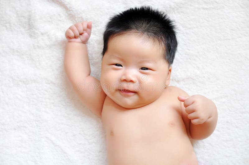 Baby smiling stock photo. Image of lying, nursing, young - 20561388