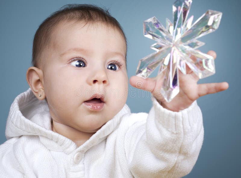 Baby with snow flake stock photo. Image of childhood - 27631756