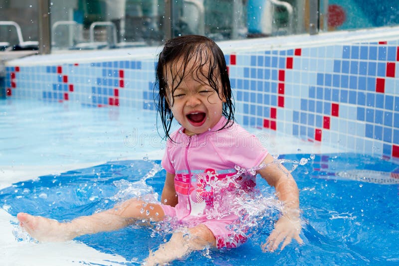 Baby Splashing at Pool stock photo. Image of young, splash - 20139748