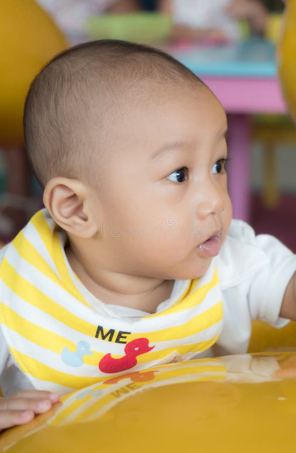 Baby stand holding sofa stock photo. Image of look, eyes - 62517466