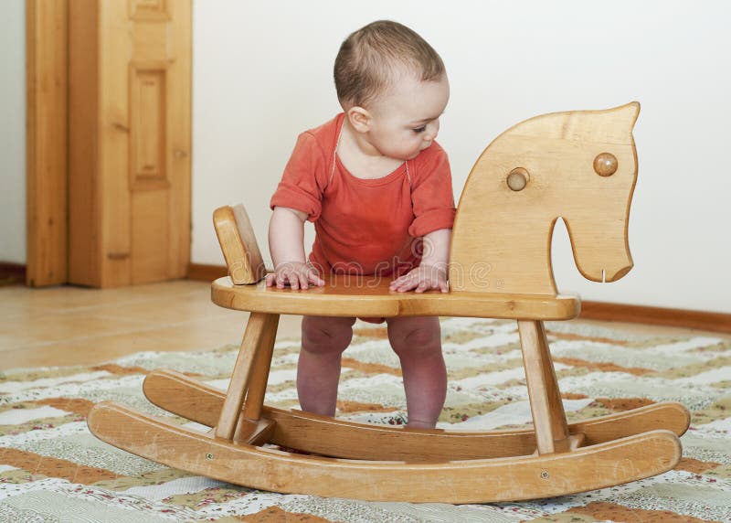 Baby Standing by Mother S Legs Stock Image - Image of playing, small ...