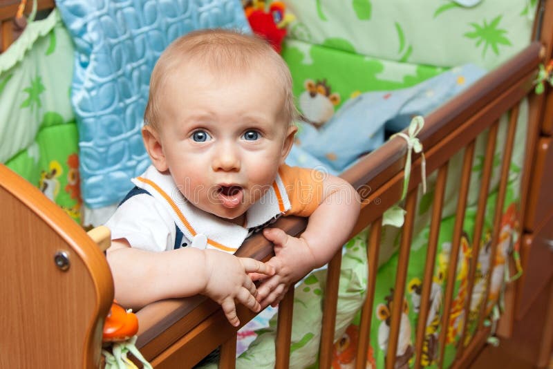 Baby standing in crib stock photo. Image of humor, standing - 24334278