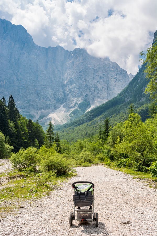 Baby Stroller in Mountain Valley. Stock Photo - Image of newborn, sunny ...