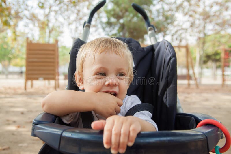 Baby in stroller stock photo. Image of sitting, summer - 34937724