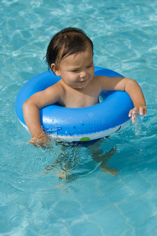 Baby with swimming tires stock image. Image of summer - 6572775