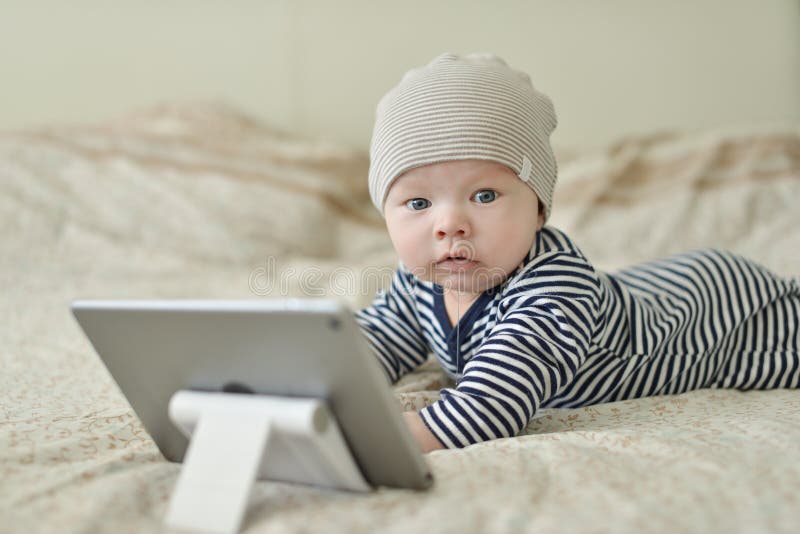 Baby with tablet pc stock photo. Image of lying, empty - 110194834