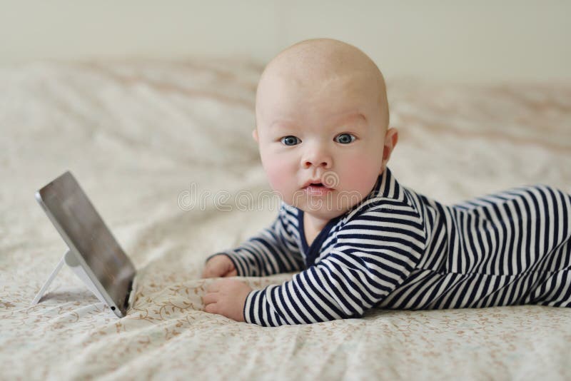 Baby with tablet pc stock image. Image of electronic - 202610261