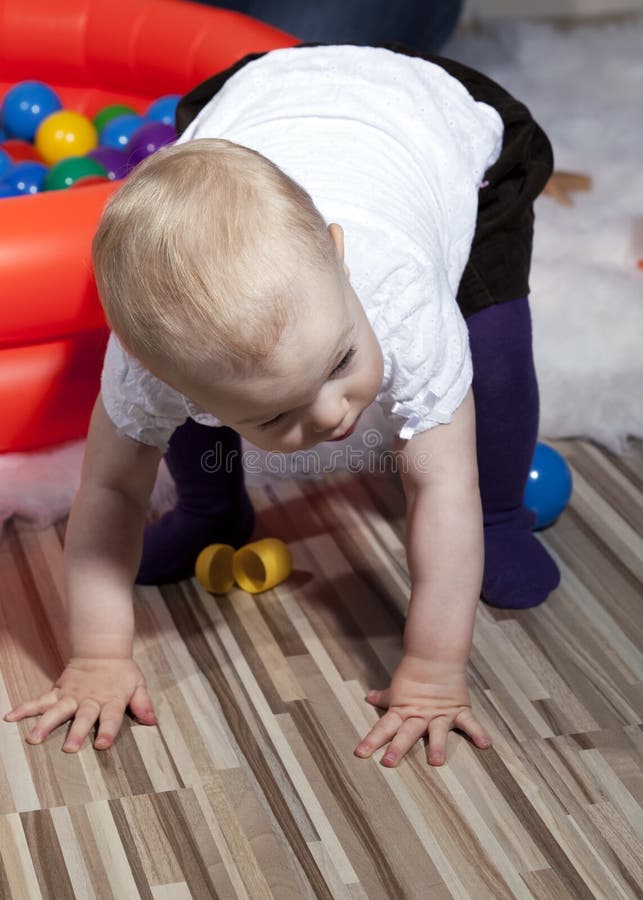 Baby taking first steps stock photo. Image of breakthrough - 23592424