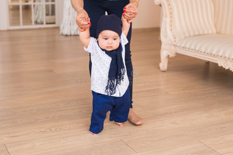 Baby Taking First Steps with Mother Help Stock Photo - Image of joyful ...