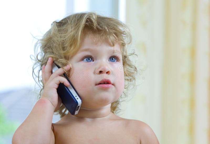 Baby calls on phone stock photo. Image of laugh, highkey - 1082844