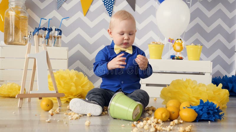 The Baby Tasting Popcorn from the Floor. Stock Video - Video of ...