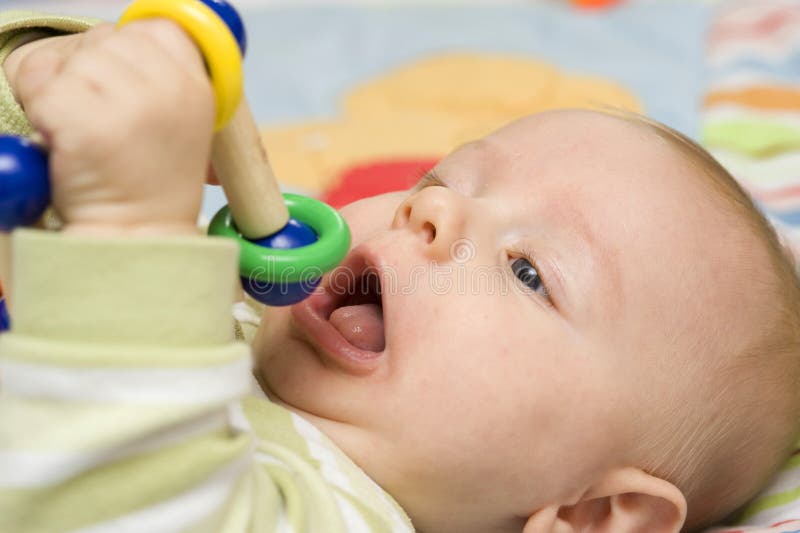 Baby tasting toy stock image. Image of laughing, hands - 9074441