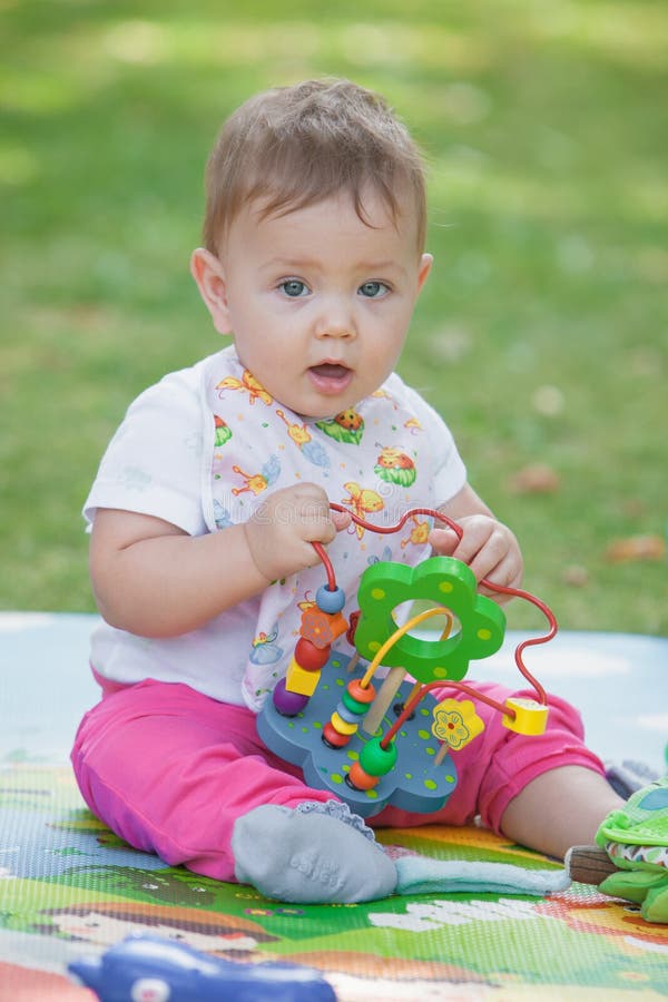 Baby, less Than a Year Old Playing with Toy Stock Photo - Image of pain ...