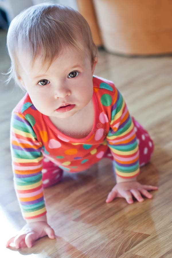 Happy Little Girl Crawling on the Hardwood Floor Stock Image - Image of ...