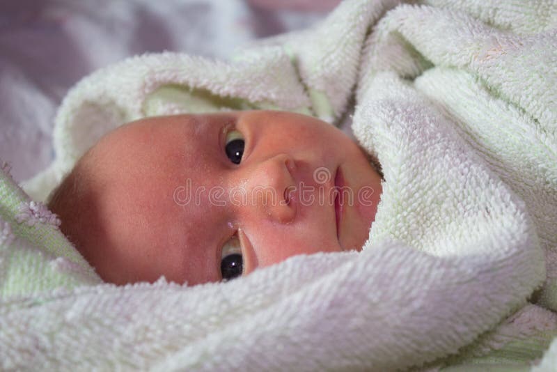 Baby in a Towel,newborn Baby after Bathing in a Towel Stock Photo ...
