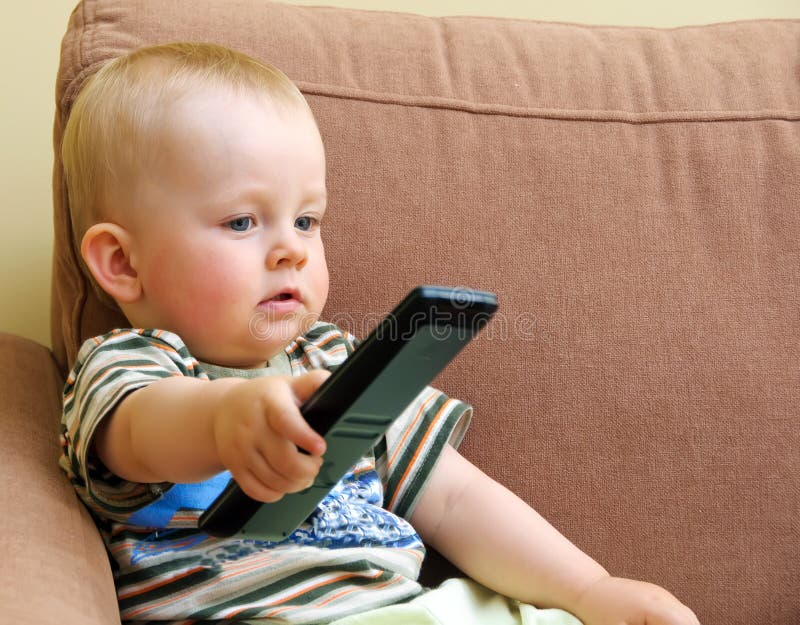 Baby and TV remote stock image. Image of watching, child - 22123389