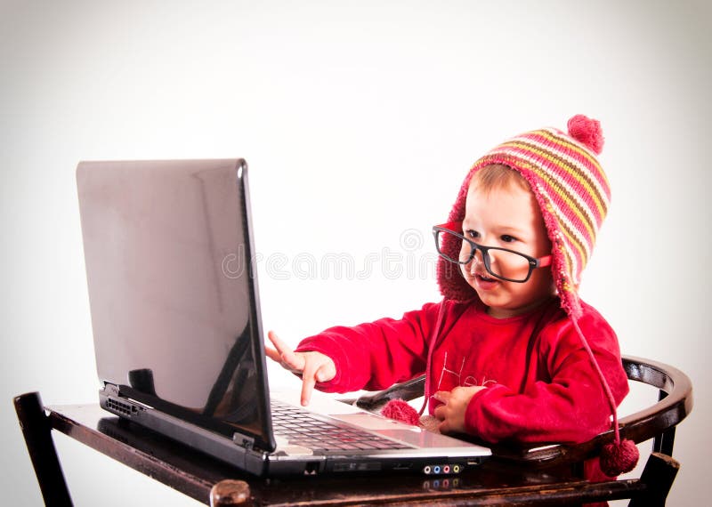 Baby typing on keyboard stock image. Image of display - 36990273