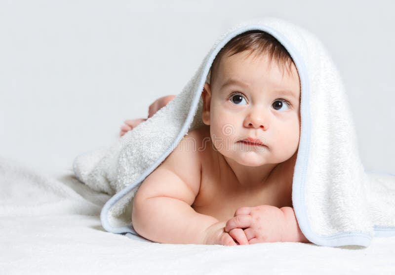 Baby under white towel stock image. Image of innocence - 23700669