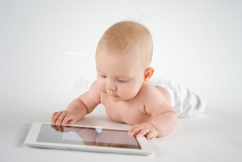 Baby using digital tablet stock image. Image of behavior - 28863655
