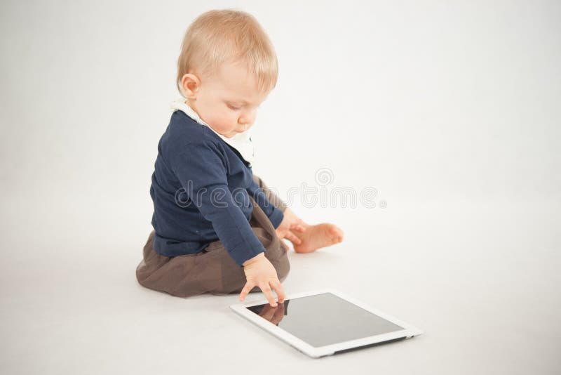 Baby using digital tablet stock image. Image of behavior - 28863655