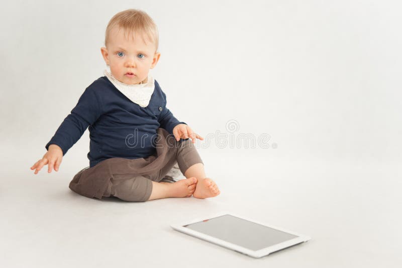 Baby using digital tablet stock image. Image of behavior - 28863655