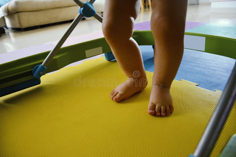 Baby Walking with the Help of a Walker Stock Image - Image of ...