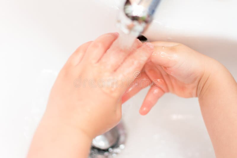 Baby washing his hands stock image. Image of hands, toddler - 136613013