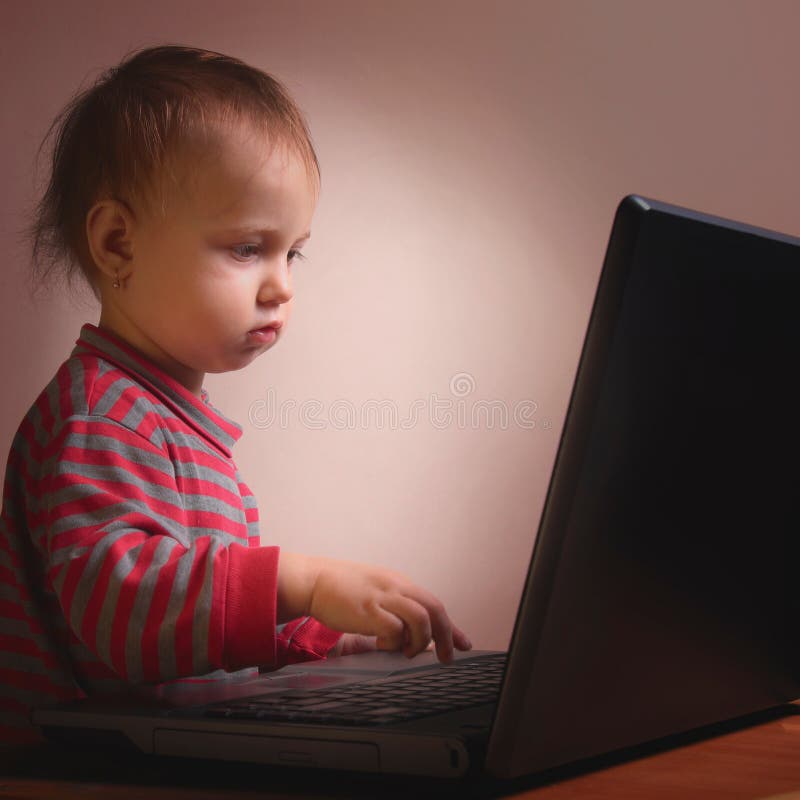 Baby is watching computer stock photo. Image of watching - 64495184