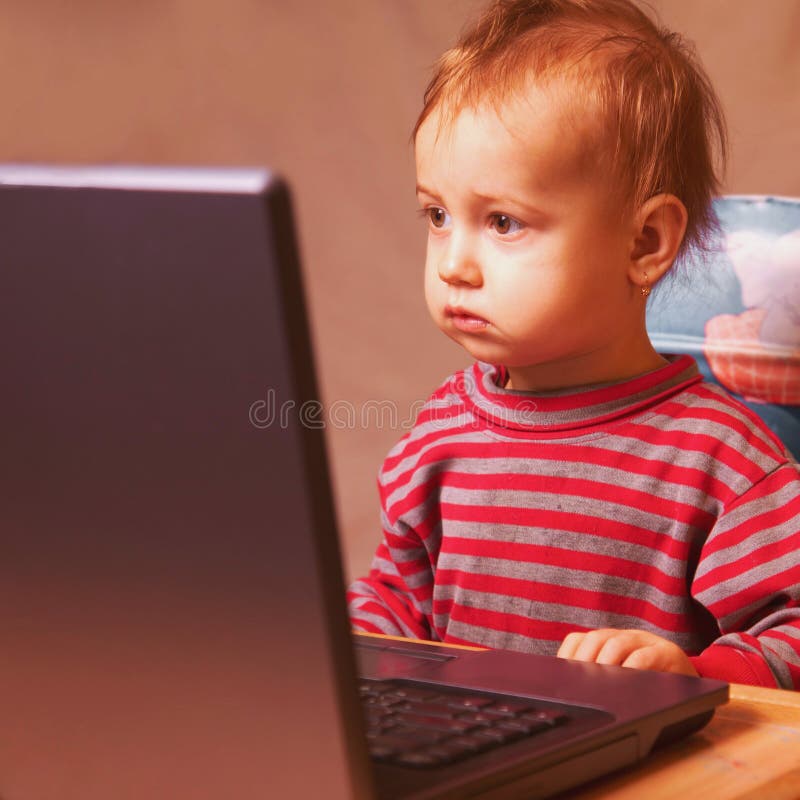Baby is watching computer stock photo. Image of watching - 64495184