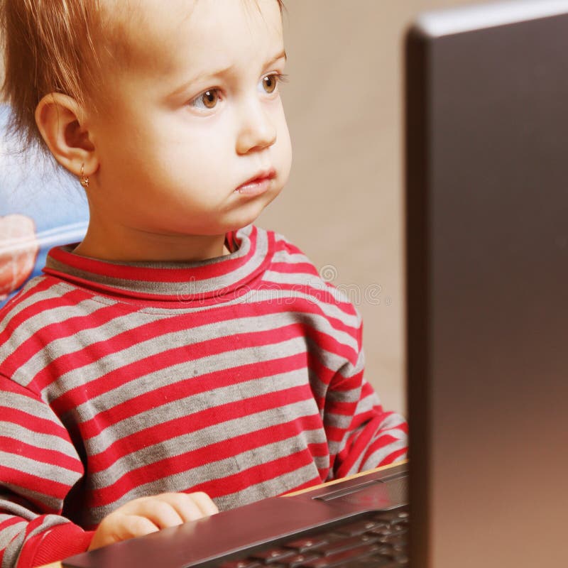 Baby is watching computer stock photo. Image of watching - 64495184