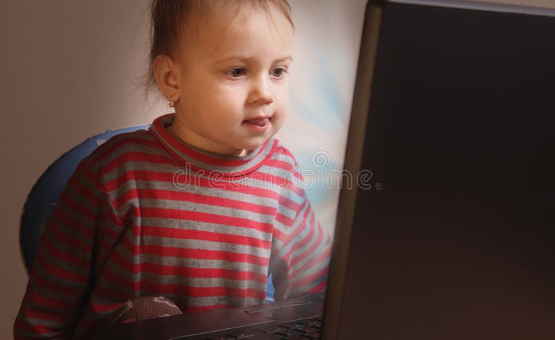 Baby is watching computer stock photo. Image of small - 70628270