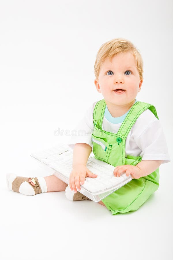 Baby with white keyboard stock photo. Image of cheery - 10074348