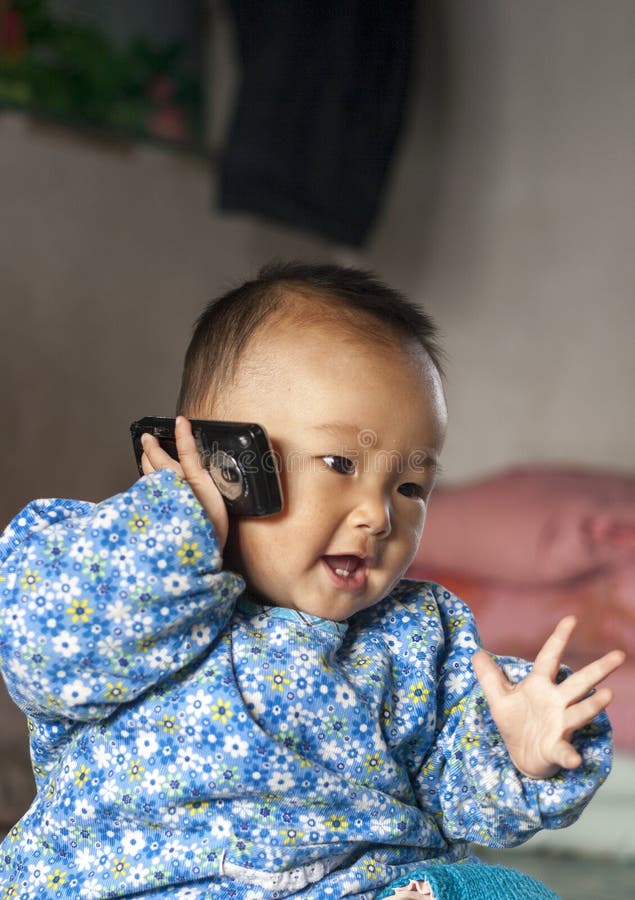 The Baby Whom that Cellular Phone Makes a Phone Call Stock Photo ...