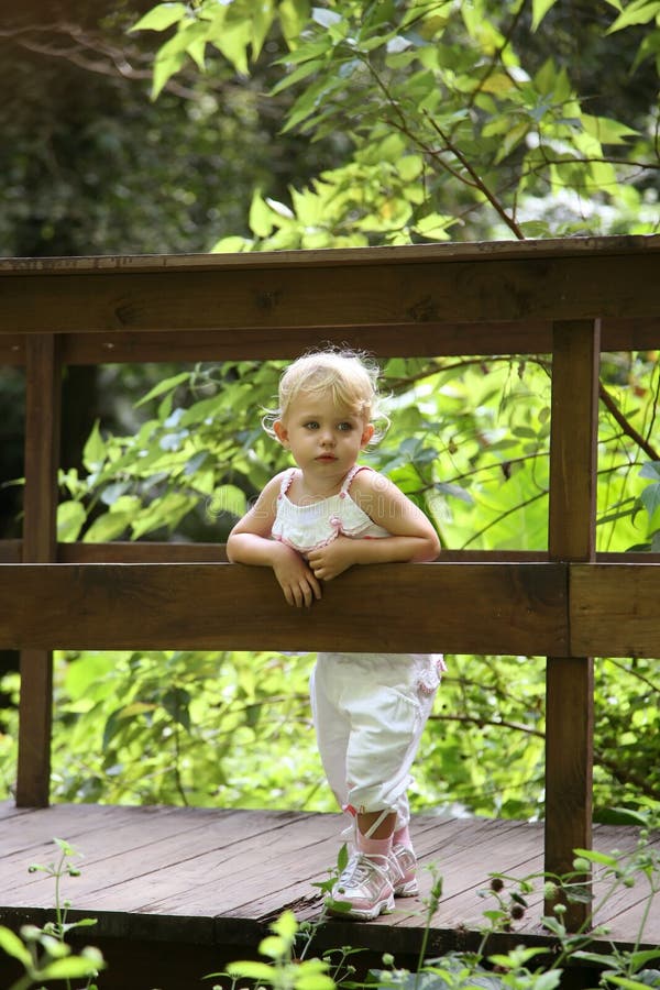 Baby girl at the beach stock photo. Image of young, hair - 12586608