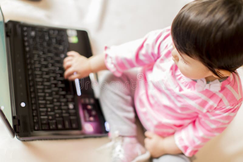 Baby typing on computer stock photo. Image of excited - 24430272