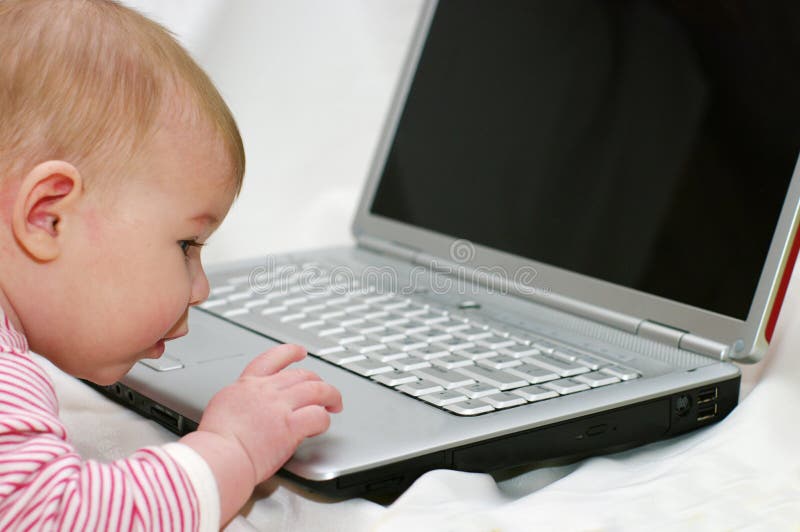 Baby working on Laptop stock image. Image of adoption - 7578949