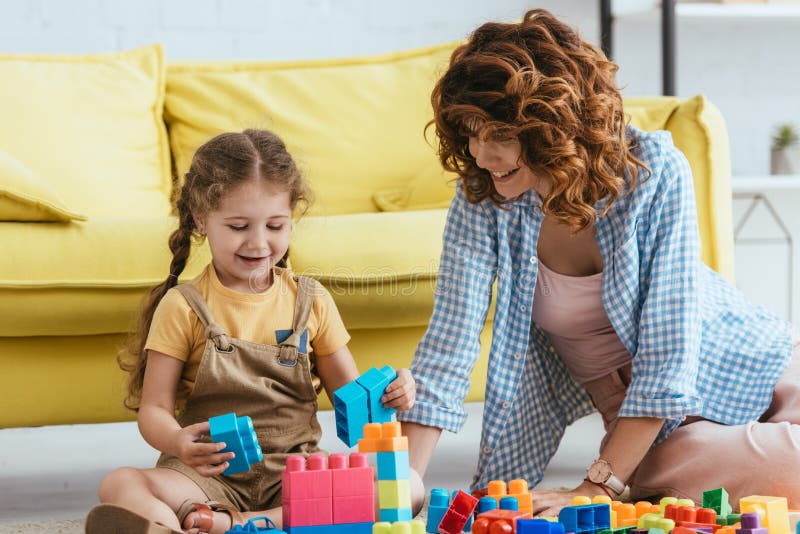 Babysitter and Child Playing with Building Stock Image - Image of ...