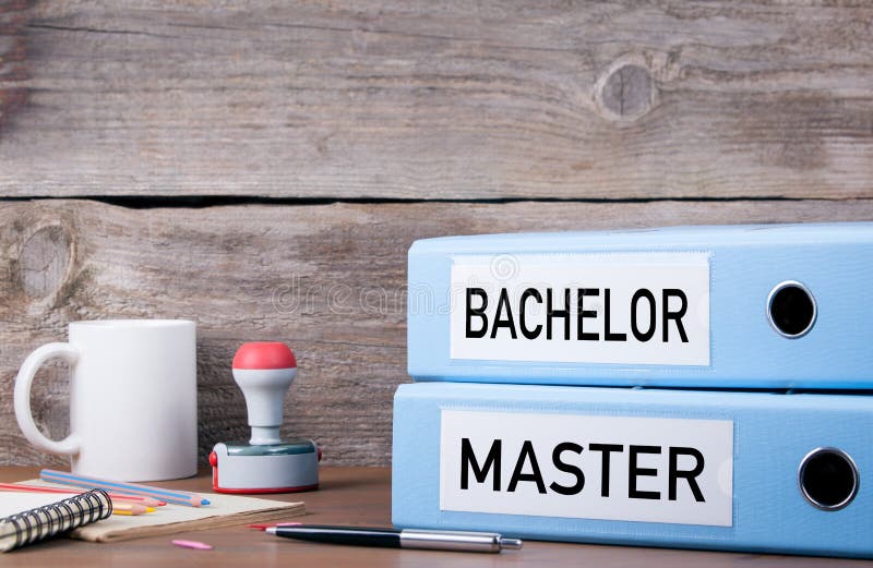 Bachelor and Master. Two Binders on Desk in the Office Stock Image ...