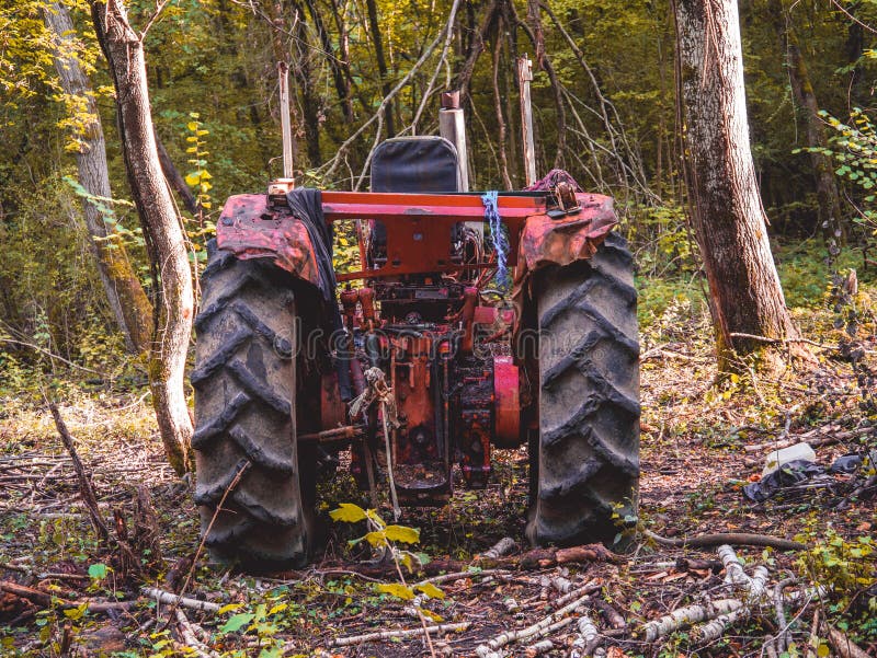 Back of an Abandoned Tractor Stock Image - Image of trunk, weed: 207457873