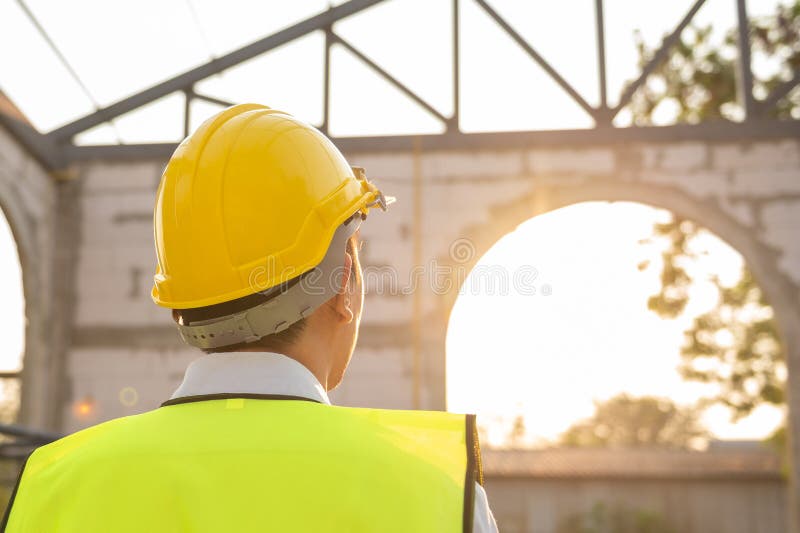 Back of Asian Engineering Man Looking To Construction Analyzing about ...