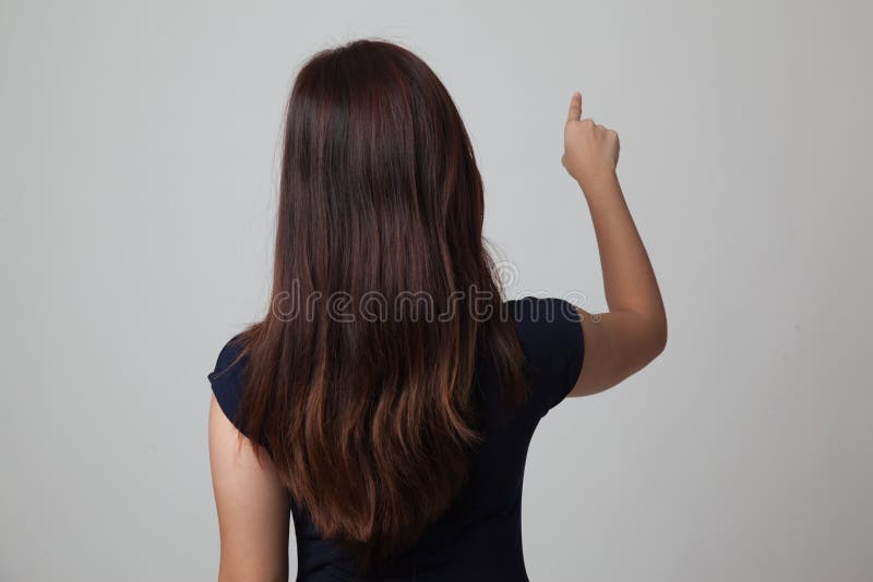 Back Of Asian Woman Touching The Screen With Her Finger. Stock Photo ...