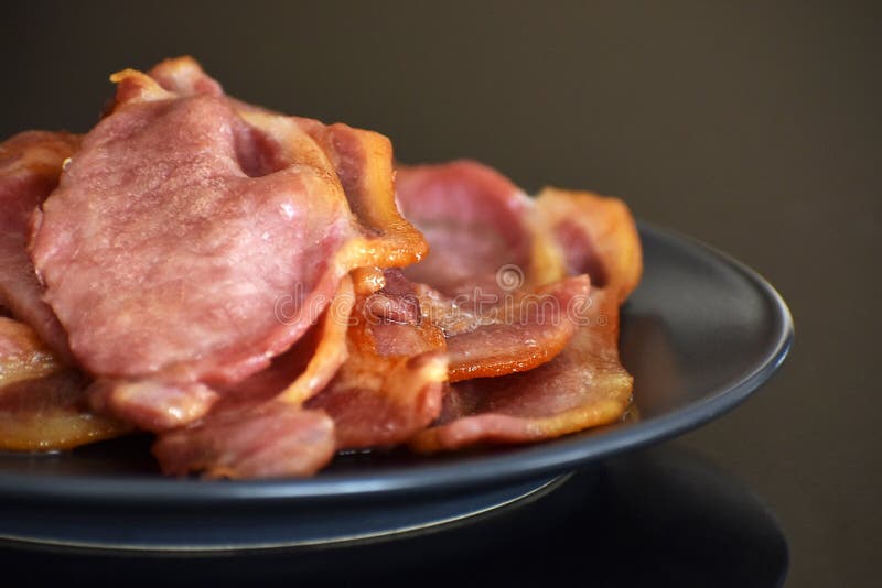 Back Bacon on a Black Plate. Stock Image - Image of food, people: 245029765