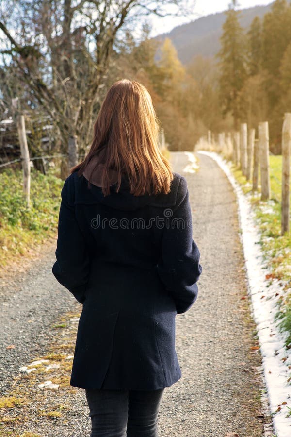 Back of Brunette Woman Walking Outdoors on a Path Stock Photo - Image ...