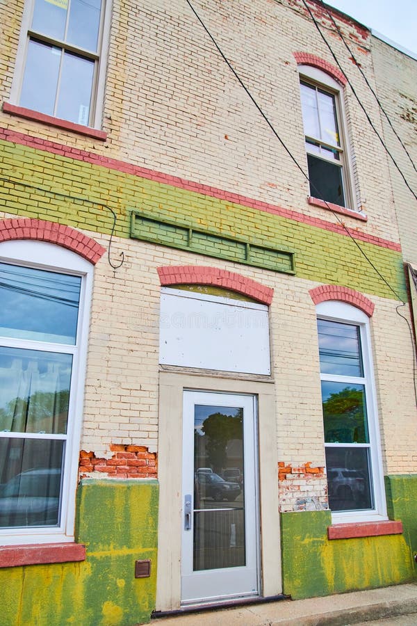 Back of Building in Alley with White, Green, and Red Bricks Stock Image ...