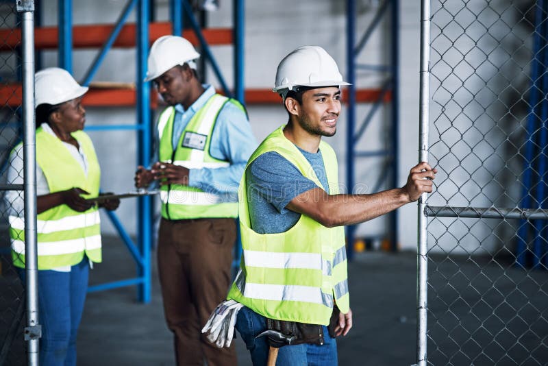 Back in Business and Back in Action. a Young Builder Opening the Gates ...