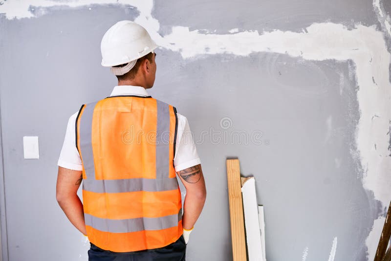 The Back of a Construction Worker in Uniform As he Faces Work in ...