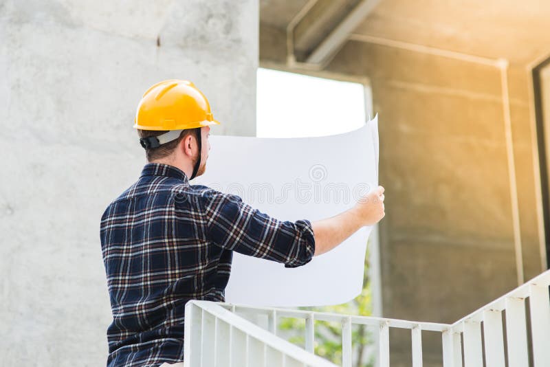 Engineer holding blueprint stock image. Image of modern - 111557675