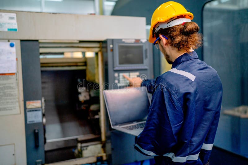 Back of Engineer or Technician Worker Press Button of Big Machine Also ...