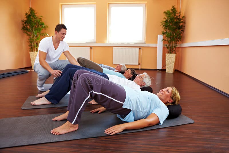 Back exercises in a group stock image. Image of pilates - 16786373